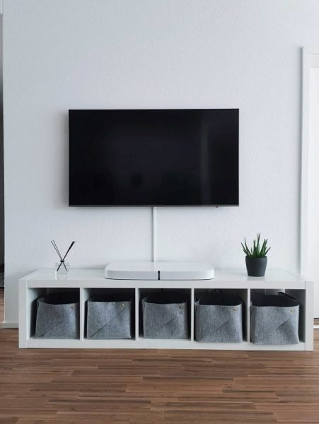 What to Put Under the TV on the Wall? [12 Ideas]